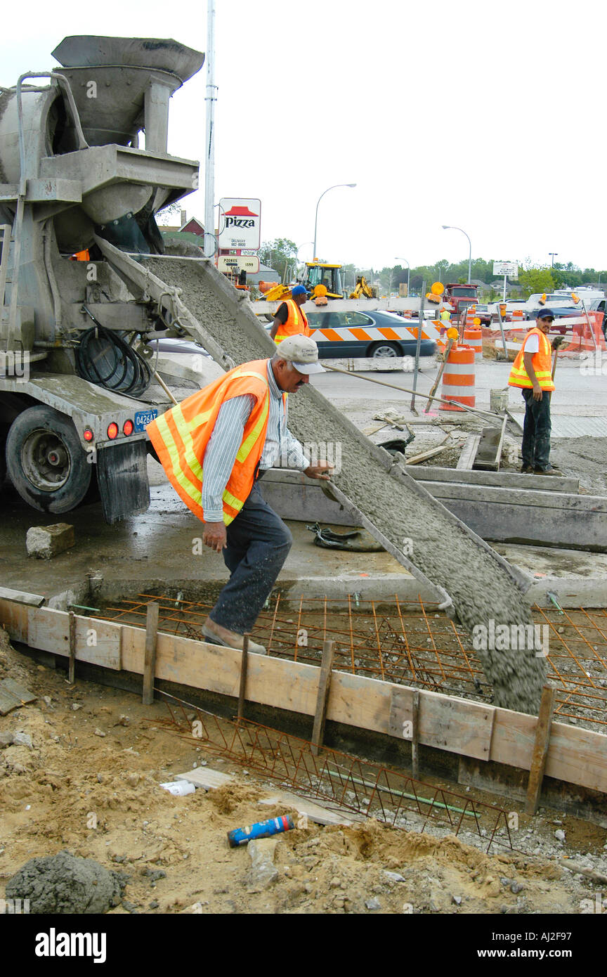 Workers Pour Cement in New Highway Construction Stock Photo - Alamy