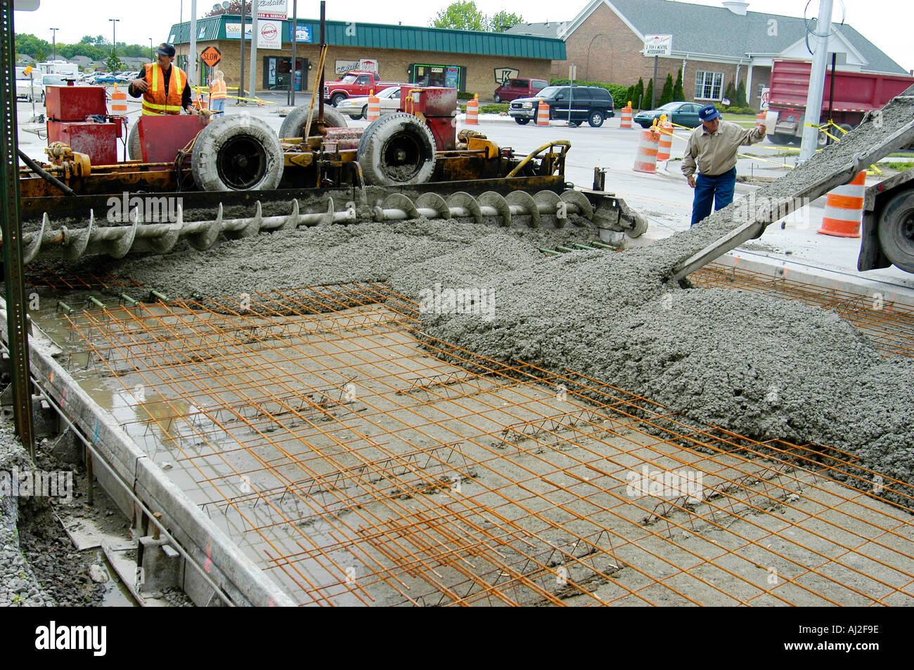 Workers Pour Cement in New Highway Construction Stock Photo - Alamy