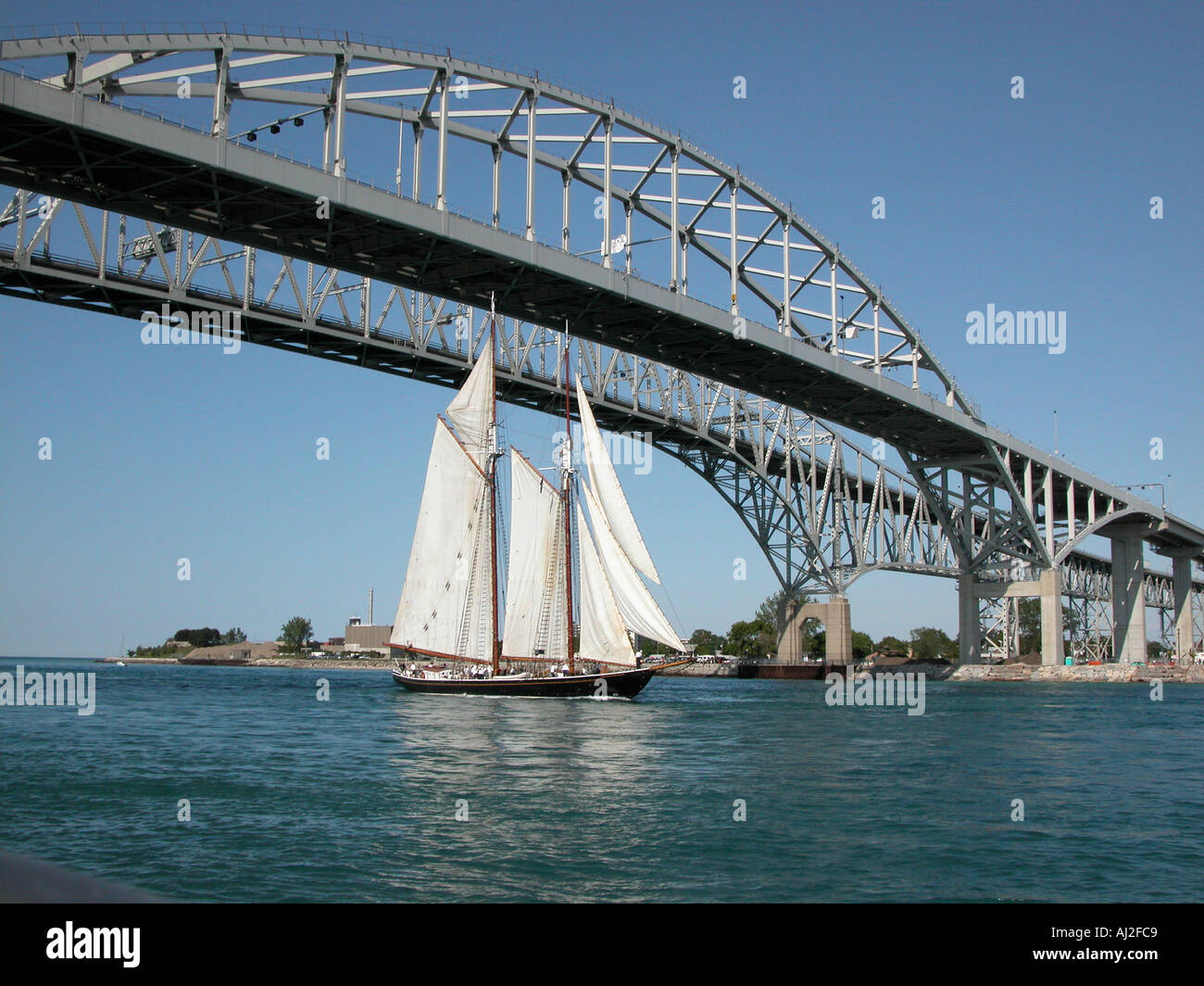 Tall Ship Highlander Sails Under Blue Water International Bridge Port ...