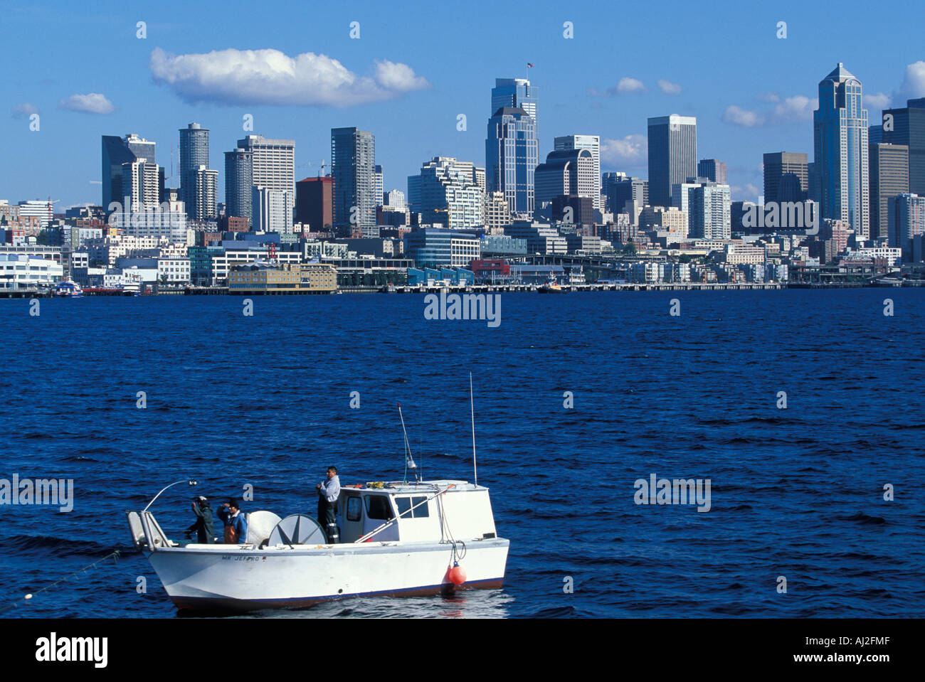 USA Washington Seattle Small gillnet skiff motors through Elliot Bay ...