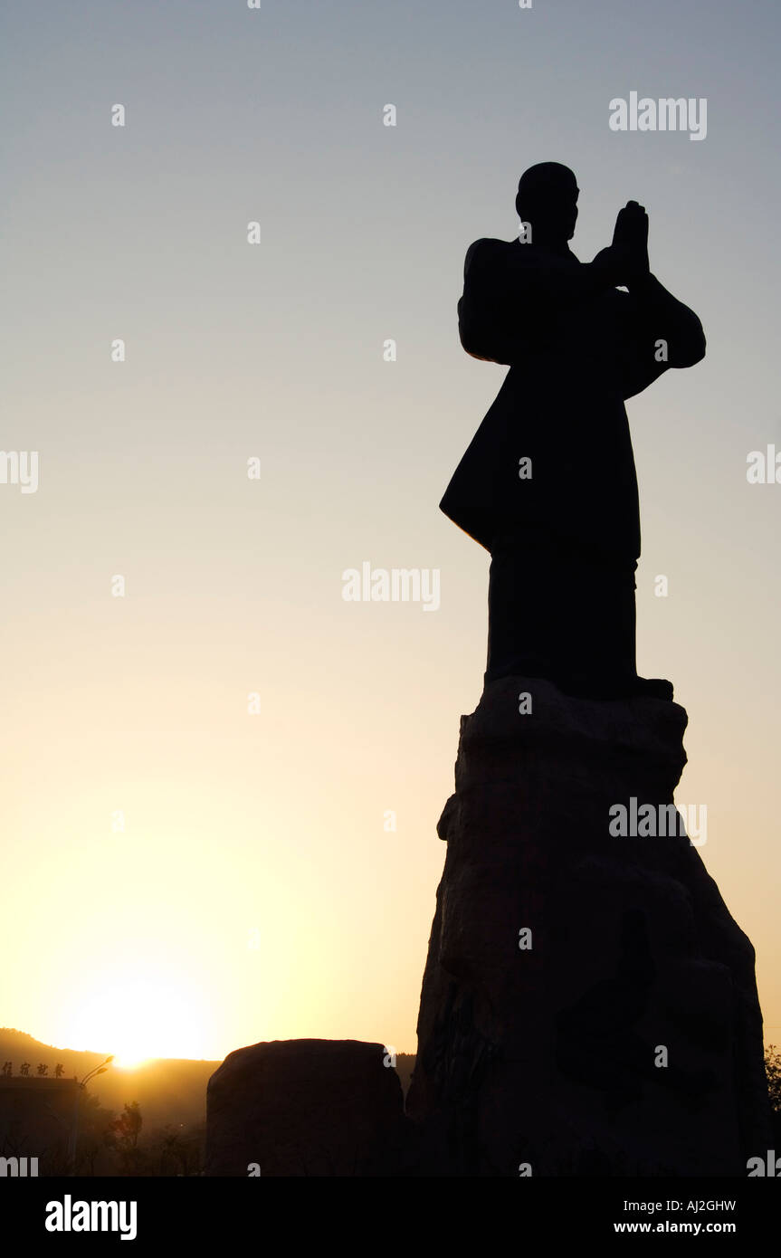 Sunset over a Kung Fu masters monument in Shaolin, the birthplace of ...