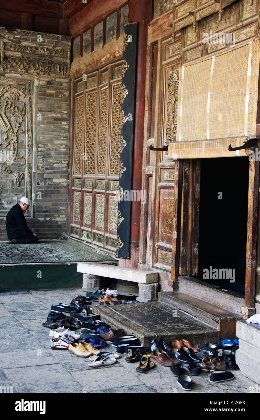 A man praying at The Great Mosque located in the Muslim Quarter, home ...