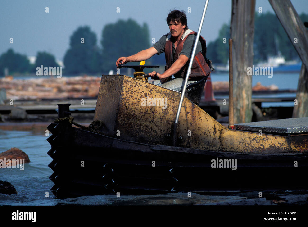 Canada British Columbia Tim McKernan pilots a Winder Boat sorting ...