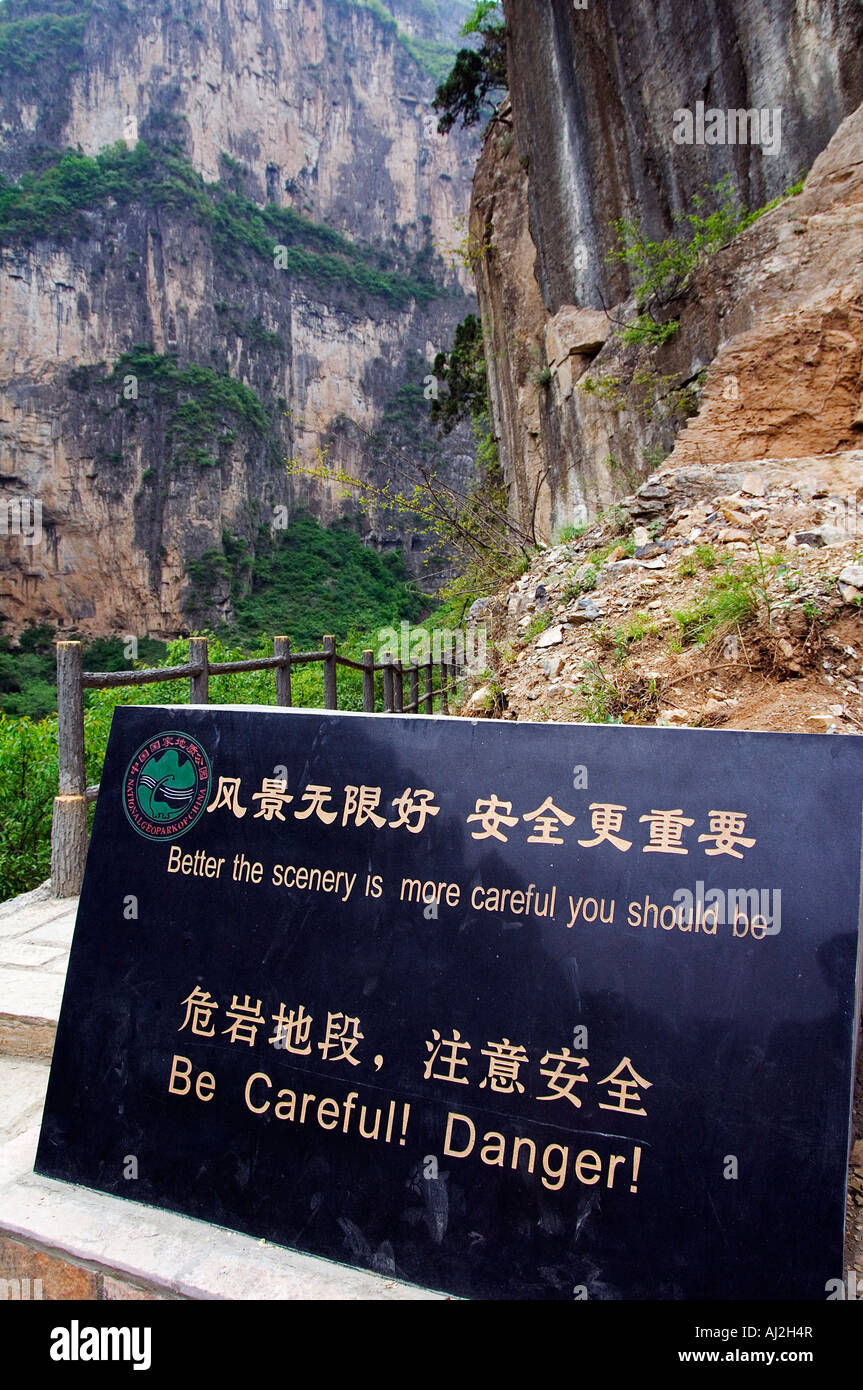 A funny sign warning of trail dangers at Wan Xian mountain recreation ...