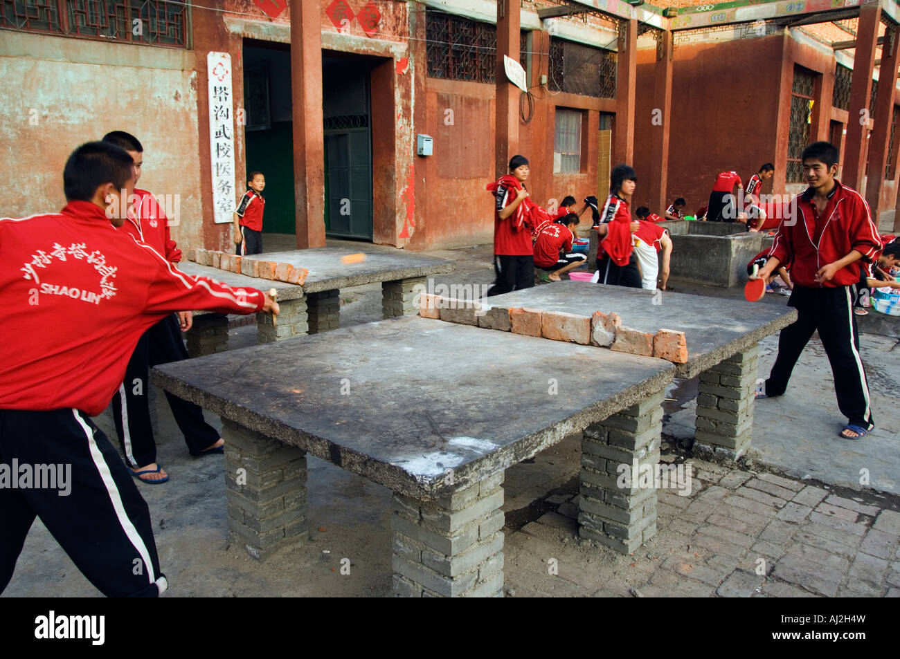 Shaolin students playing table tennis at Shaolin Monastery, Wushu ...