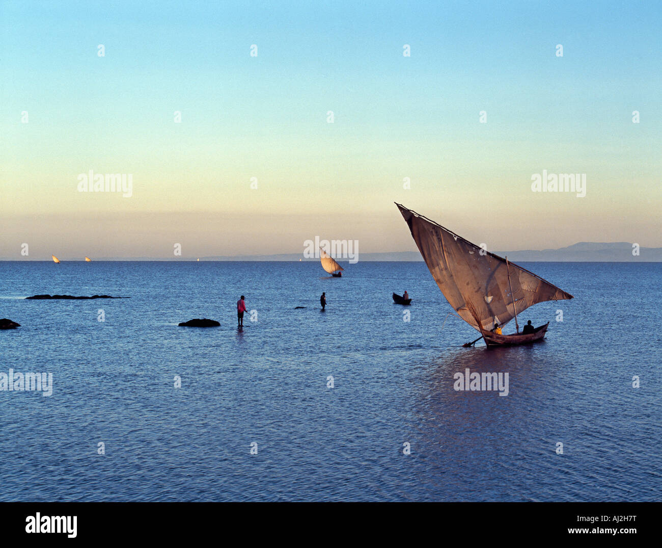 Luo fishing boats leave the eastern lakeshore of Lake Victoria in the ...