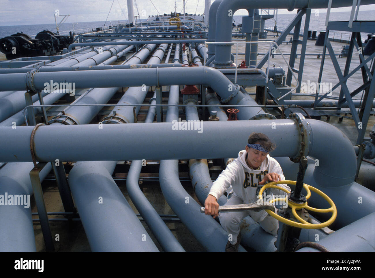 USA Alaska Second mate Karen Devine checks valves aboard Oil tanker ...