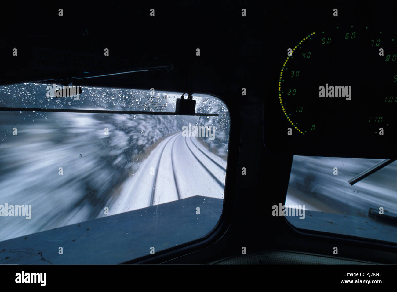 Canada Ontario VIA Rail passenger train travels down snowy tracks at 50 ...