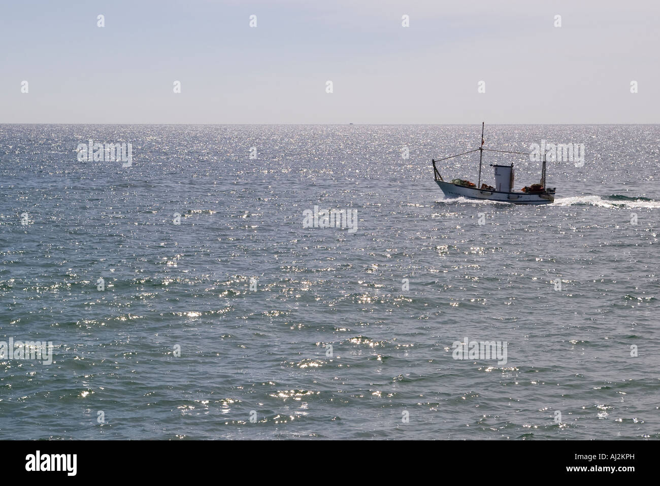 Small fishing boat horizon hi-res stock photography and images - Alamy