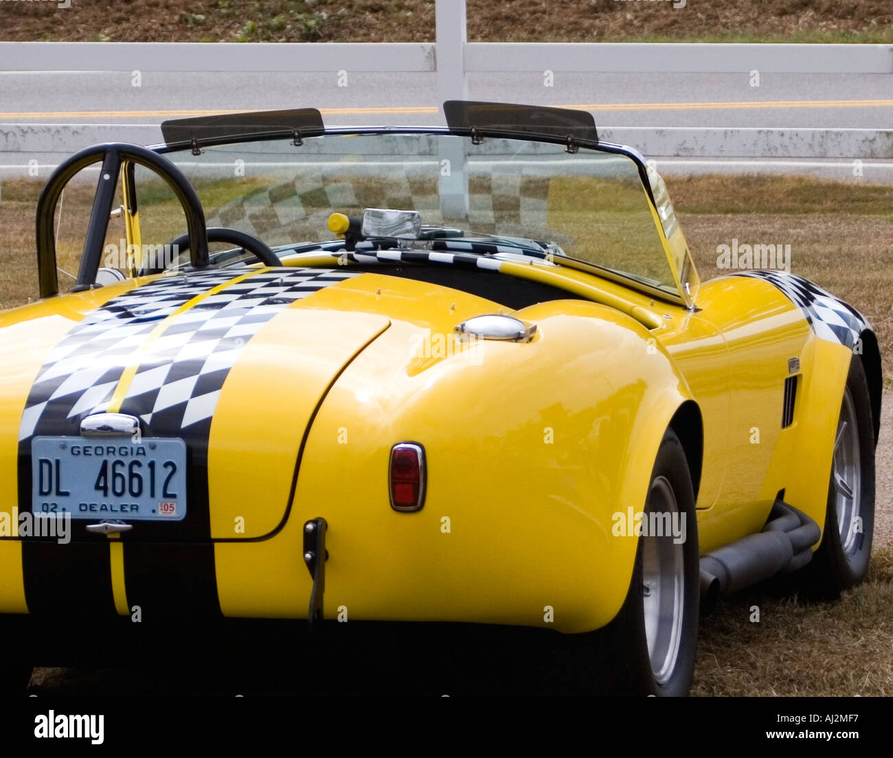 Back view of yellow Shelby Cobra Classic car bright yellow Stock Photo ...