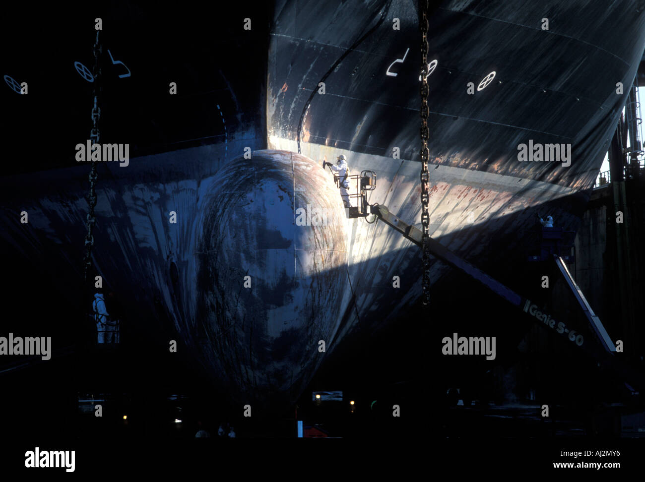 USA Washington Seattle Ship worker strips paint from hull of cruise ...