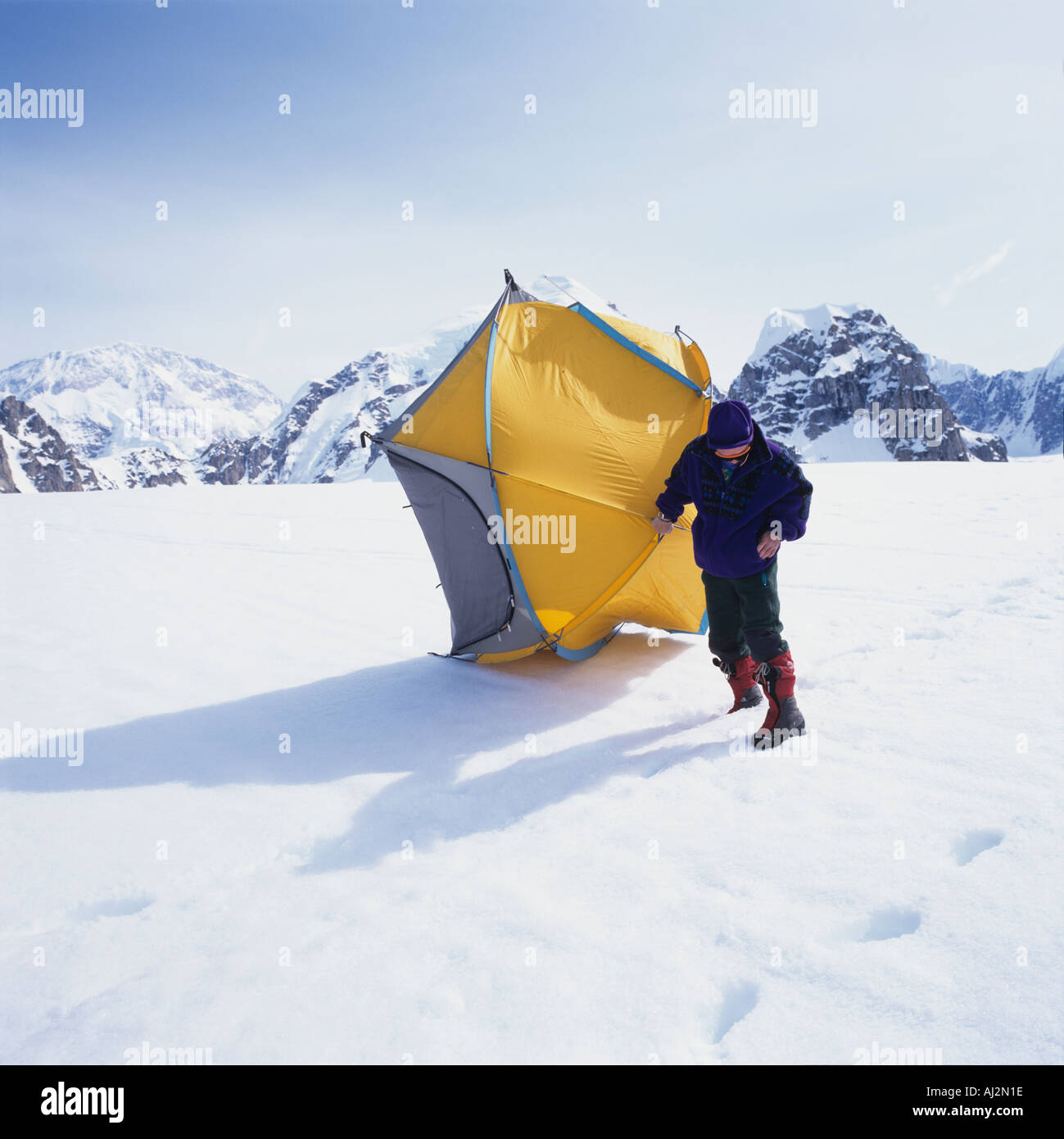 USA Alaska Denali National Park MR Russian climber retrieves tent blown ...