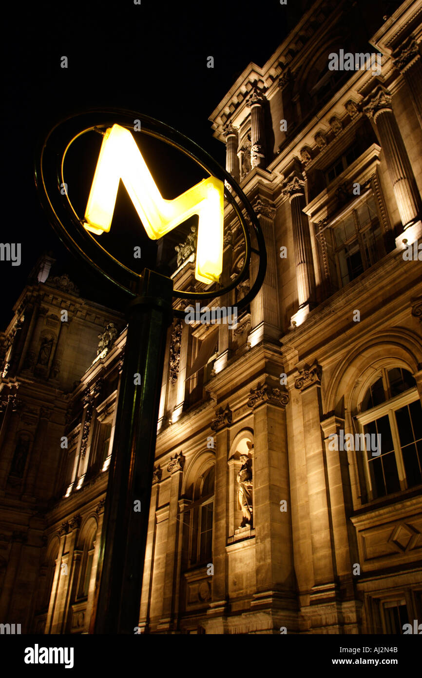 Paris France Hotel de Ville City Hall at night and subway simbol for ...