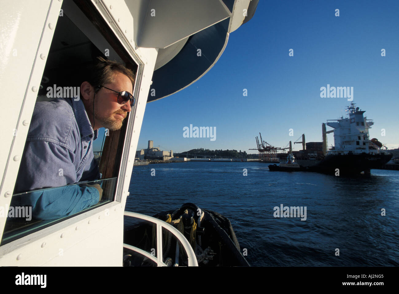 USA Washington Seattle MR Perry Overton looks from Crowley tugboat at ...