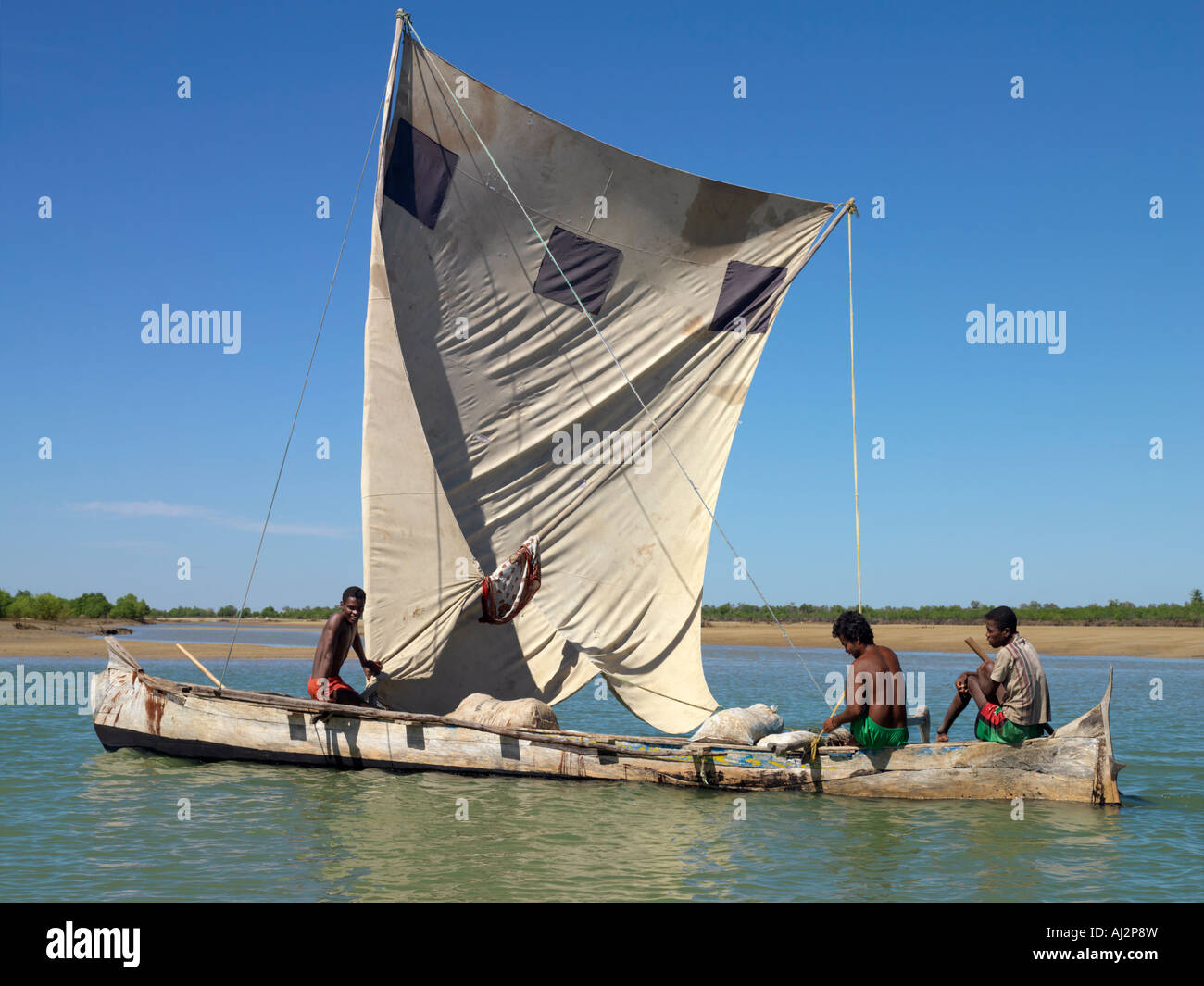 A pirogue or local fishing boat at Morondava, Madagascar Stock Photo ...
