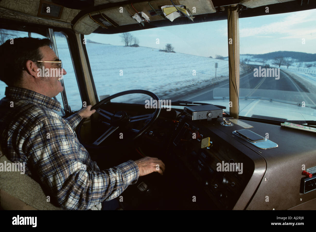 USA, North Carolina, (MR) Trucker Jesse Arnold drives through winding ...
