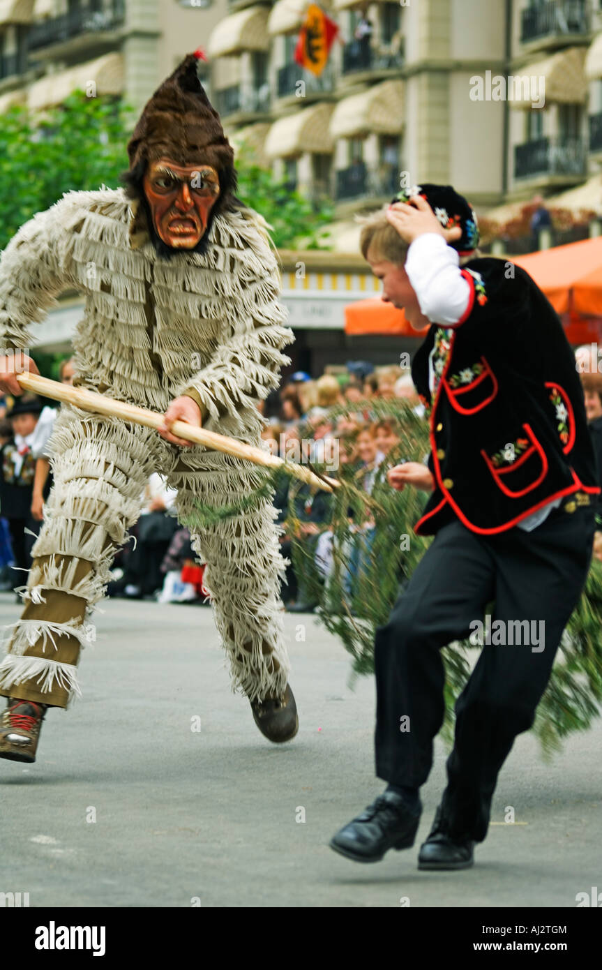 A Devil in costume chasing a young boy at the Unspunnen Bicentenary ...