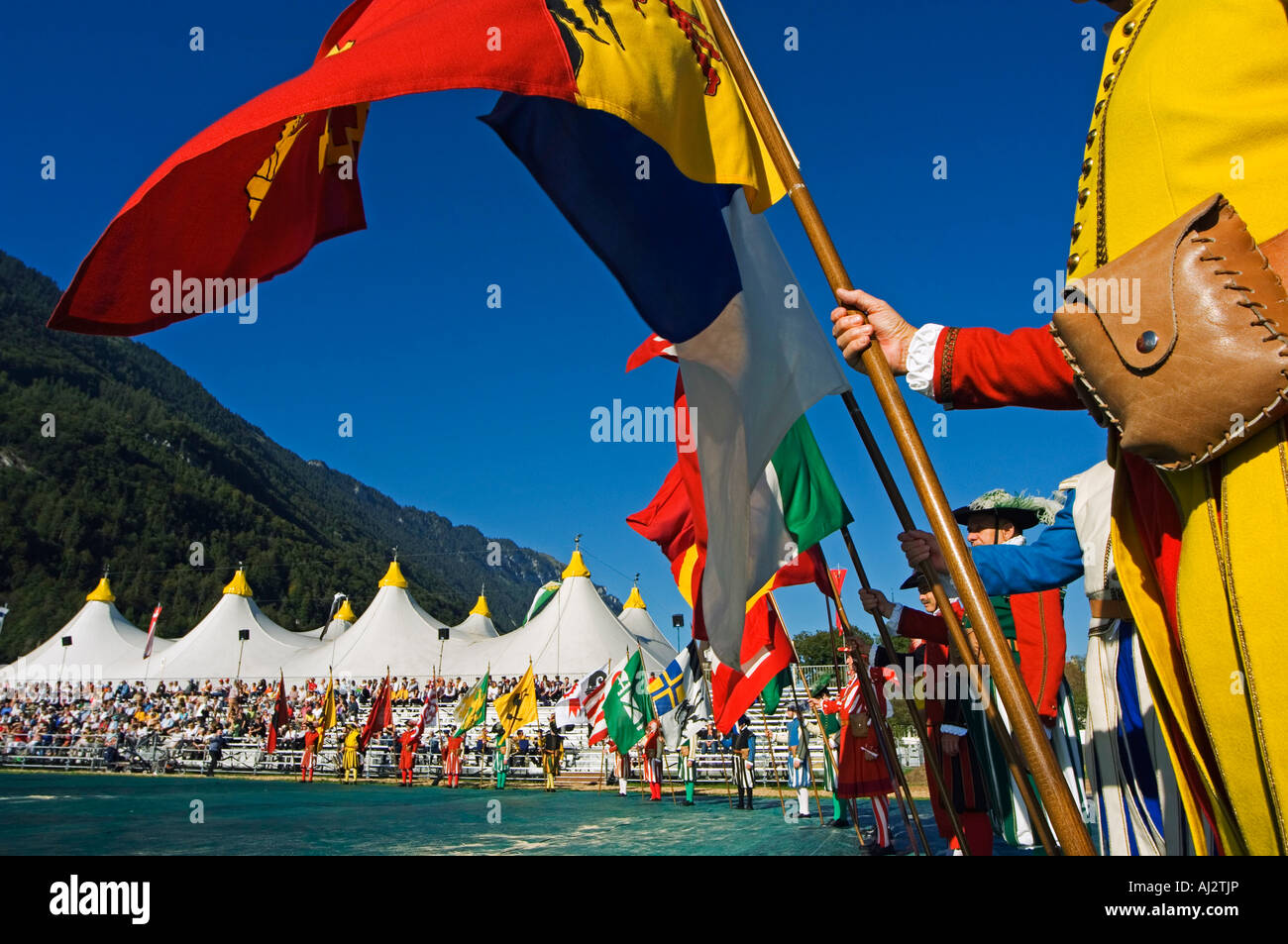 Regional flags of Switzerland are paraded at the Unspunnen Bicentenary ...