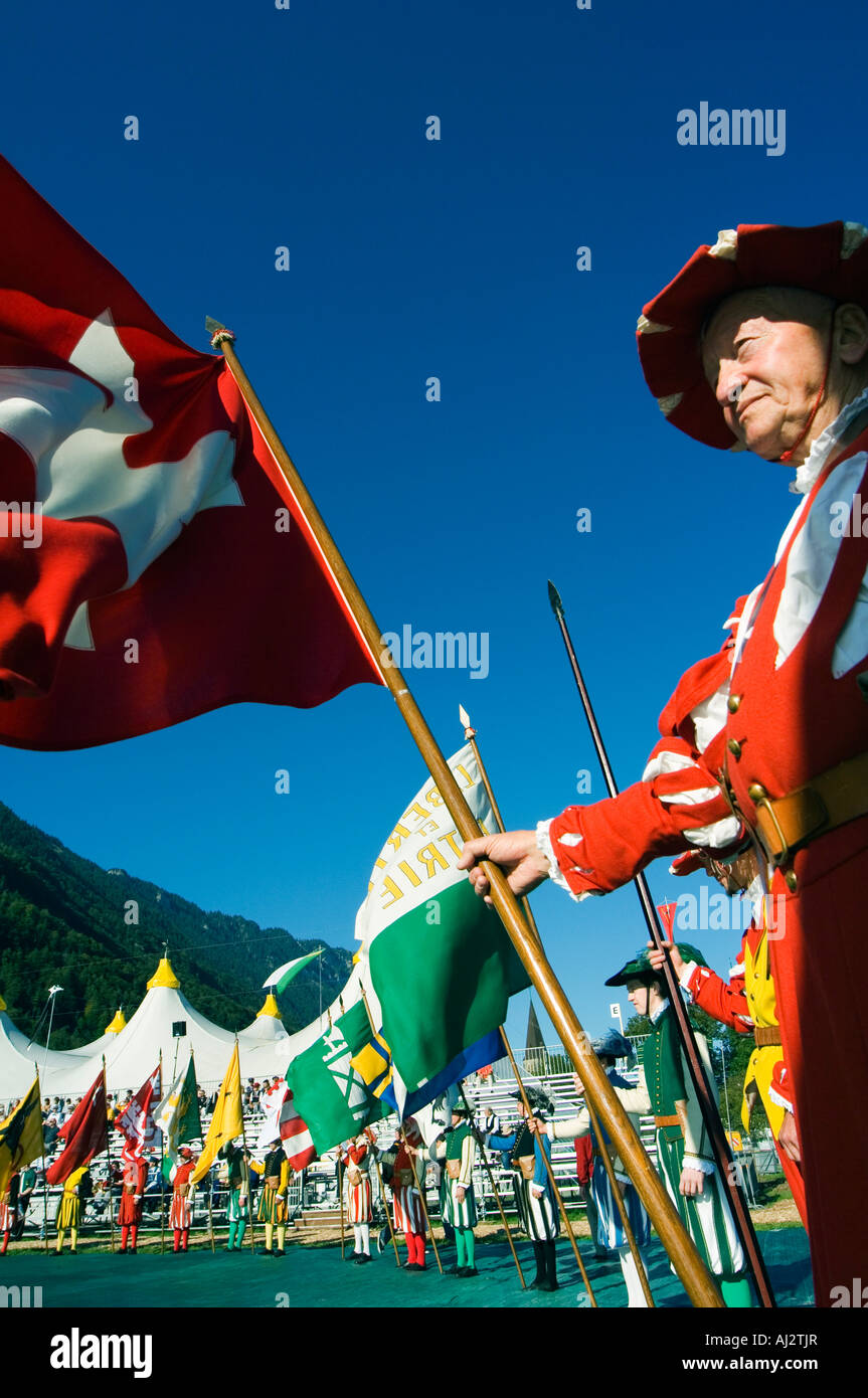 Regional flags of Switzerland are paraded at the Unspunnen Bicentenary ...