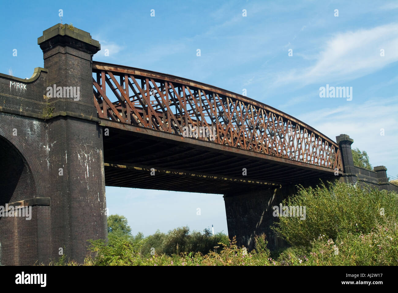 Rusting railway bridge on the main west coast railway line in the ...