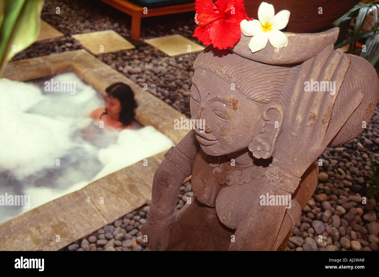 Bali woman bathing in Hotel Nusa Dua Beach Spa Stock Photo - Alamy
