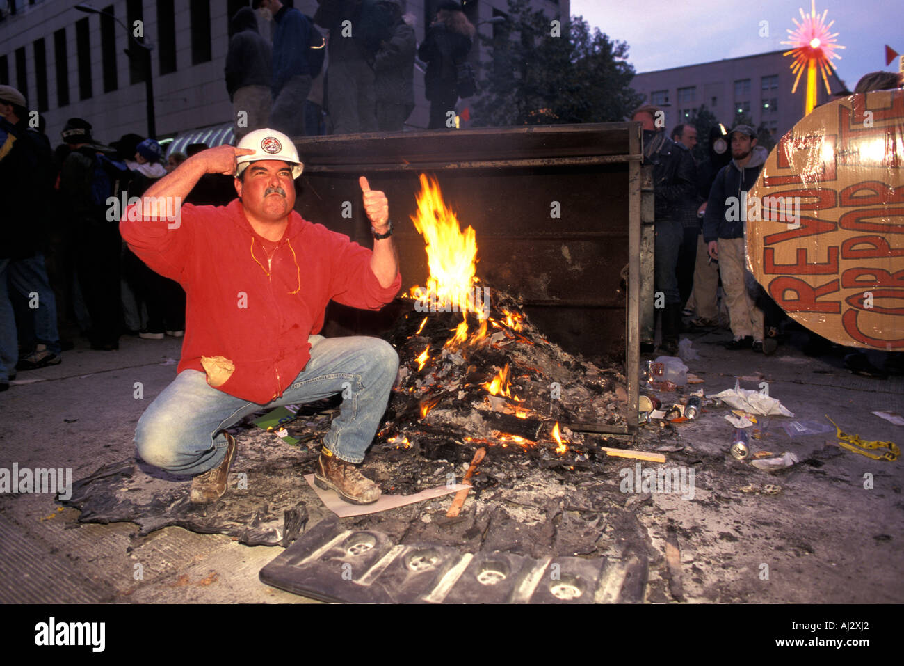 USA Washington Seattle Protester poses for snapshots by burning trash ...