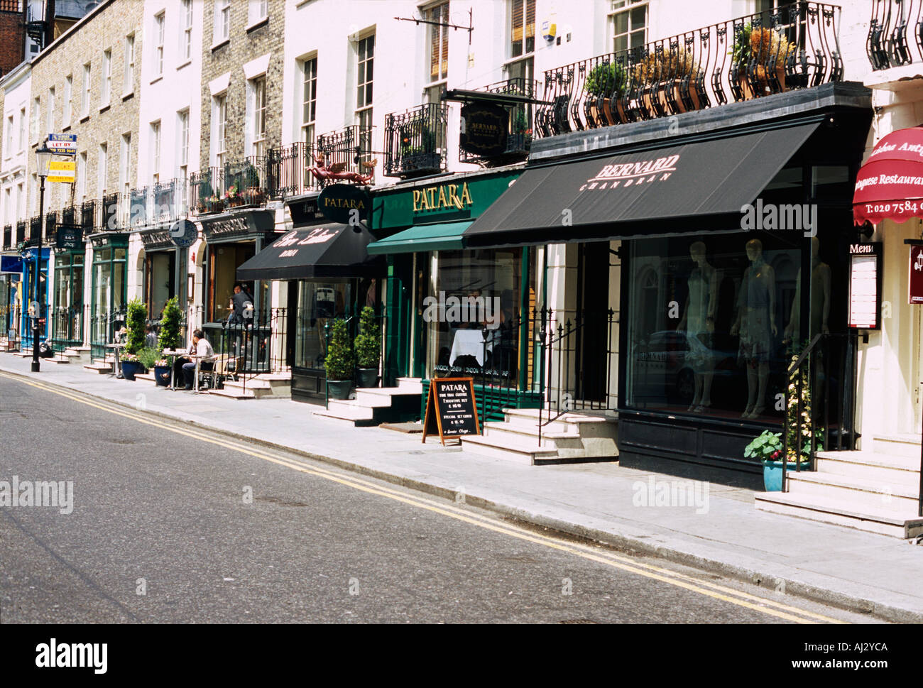 Row of shops and restaurants in Kensington London UK Stock Photo - Alamy