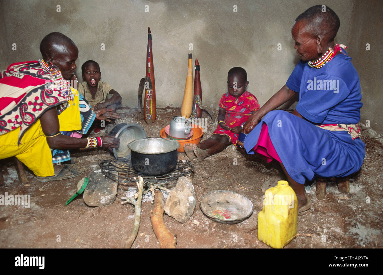 Masai family cooking in their new house. Kenya Stock Photo: 4768761 - Alamy