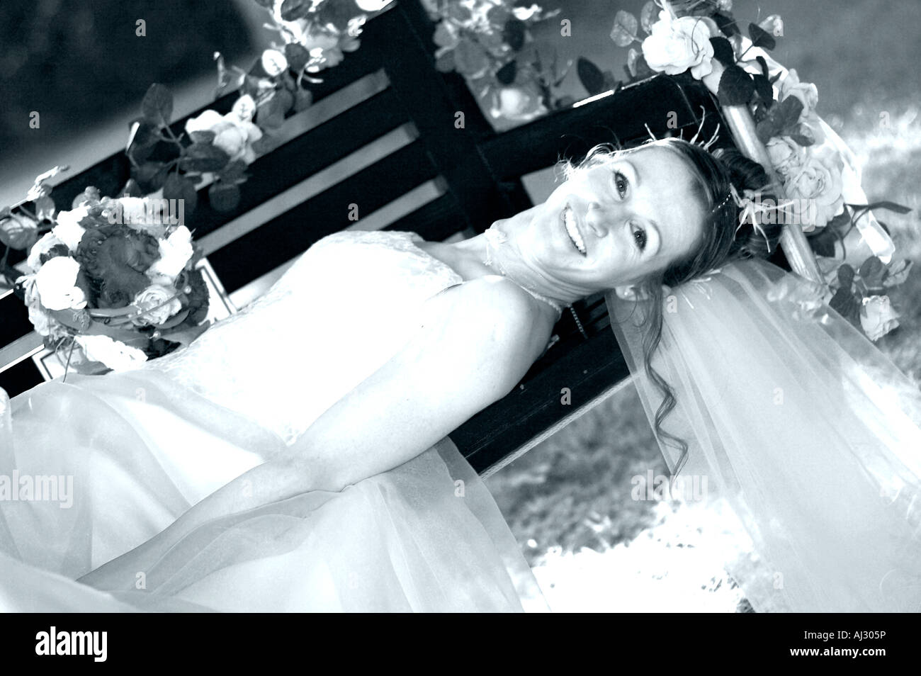 bride lying on swing Stock Photo - Alamy