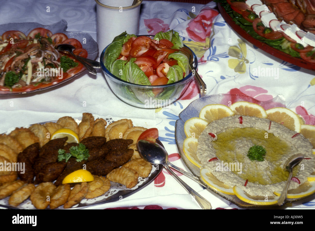 Middle Eastern mezze or appetisers on an Eid ul-Fitr banquet table to ...