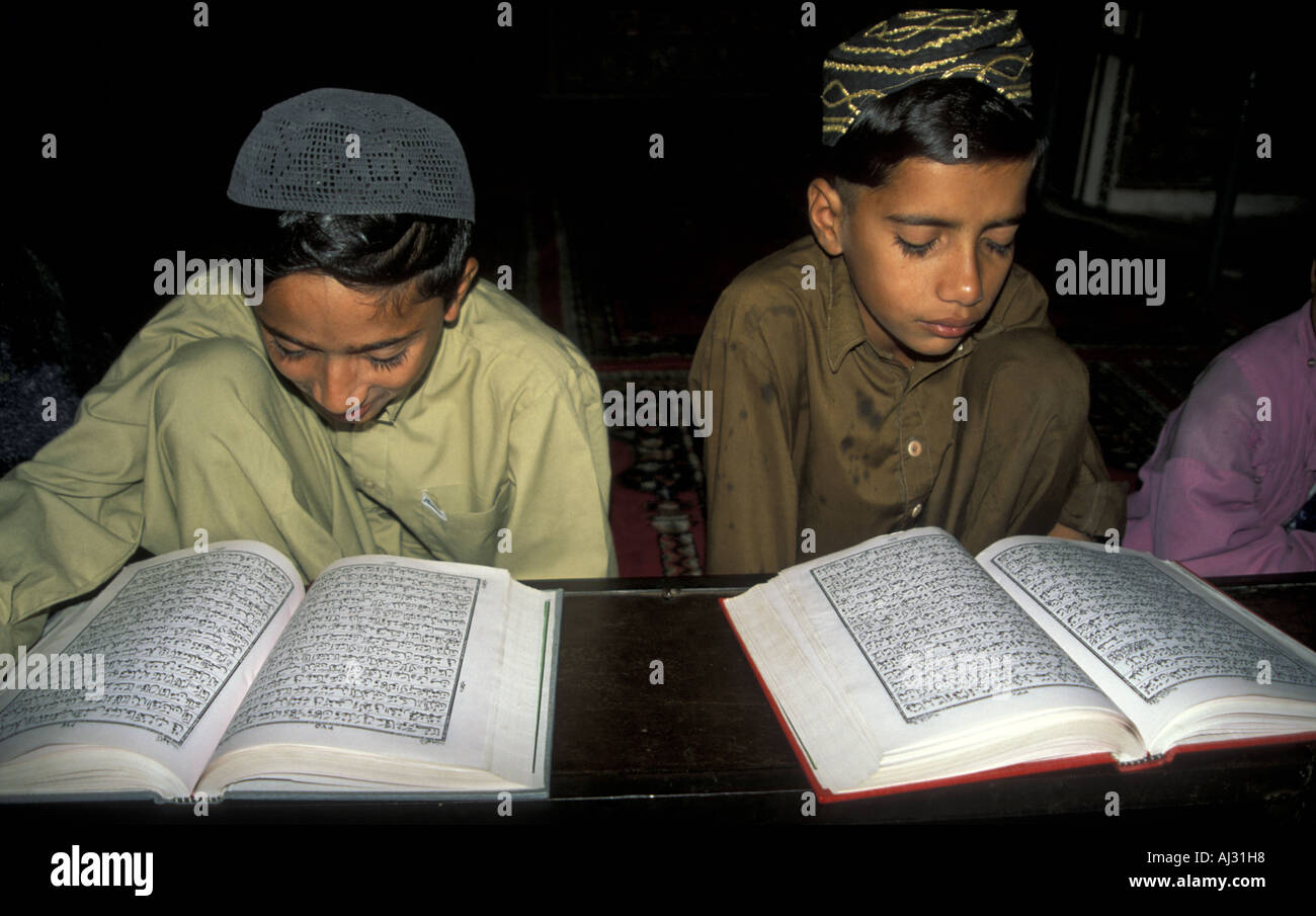 Two Muslim boys reading the Qur`an in a mosque school in Pakistan Stock ...