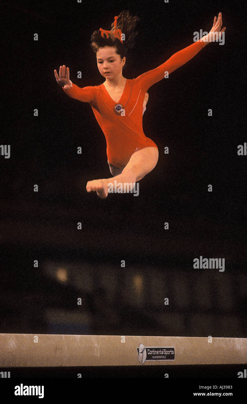 Russian woman gymnast in mid stride whilst competing on the beam Stock ...