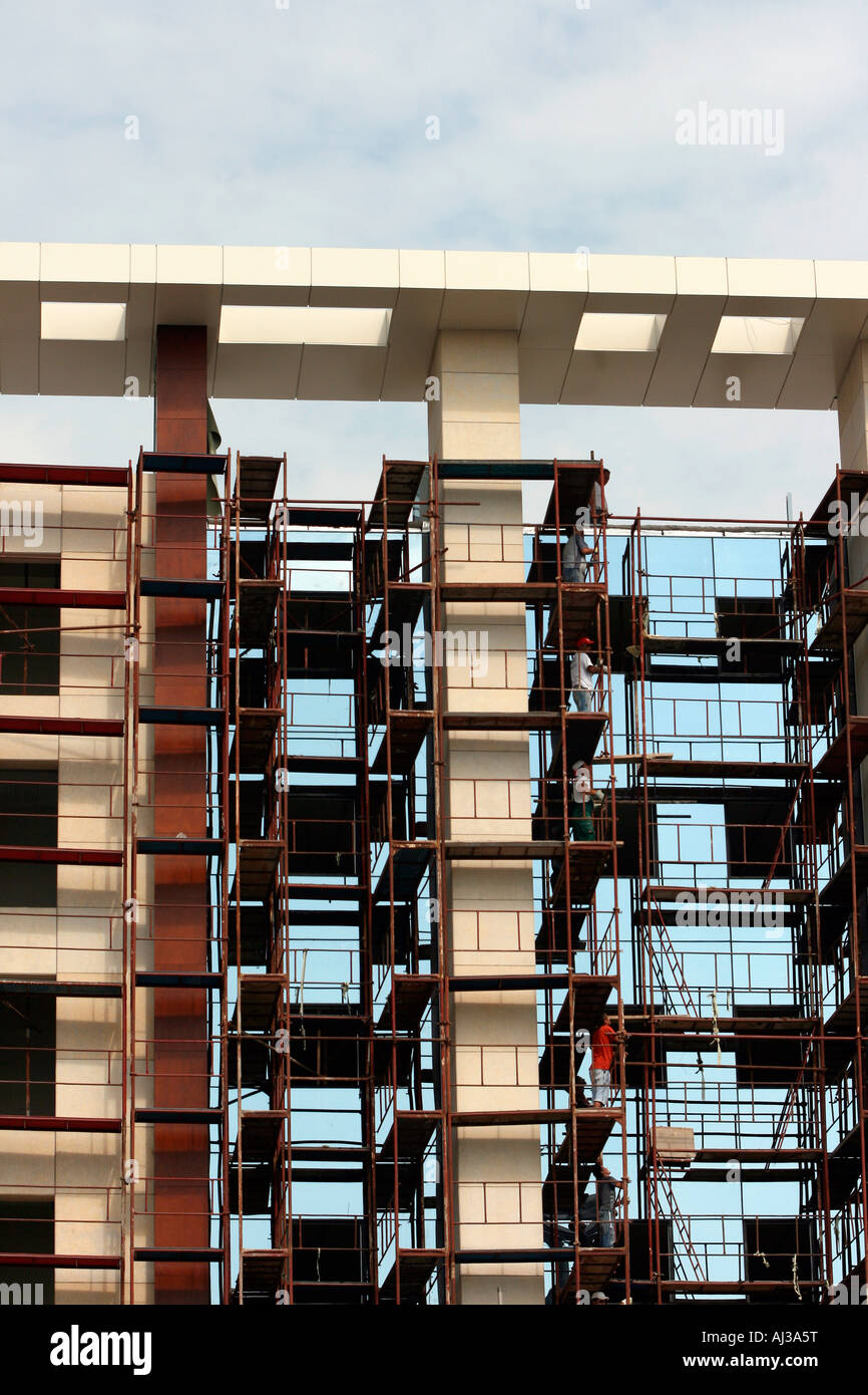 construction workers in action on a modern building vertical Stock ...