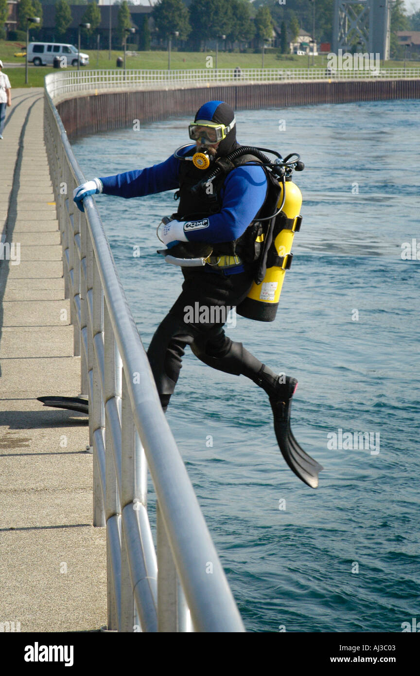 Scuba Diver Jumps into Water Stock Photo - Alamy
