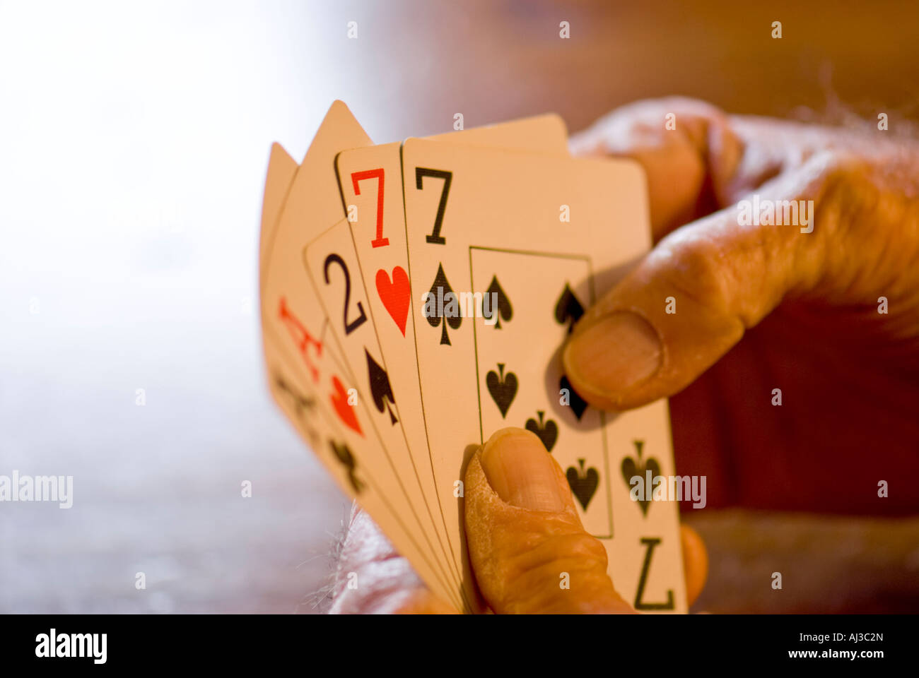 Human hand holding two cards hi-res stock photography and images - Alamy