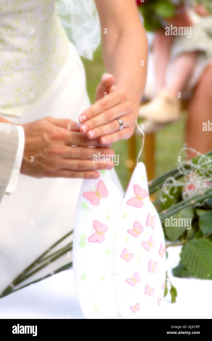 bridal couple lighting the wedding candle Stock Photo - Alamy