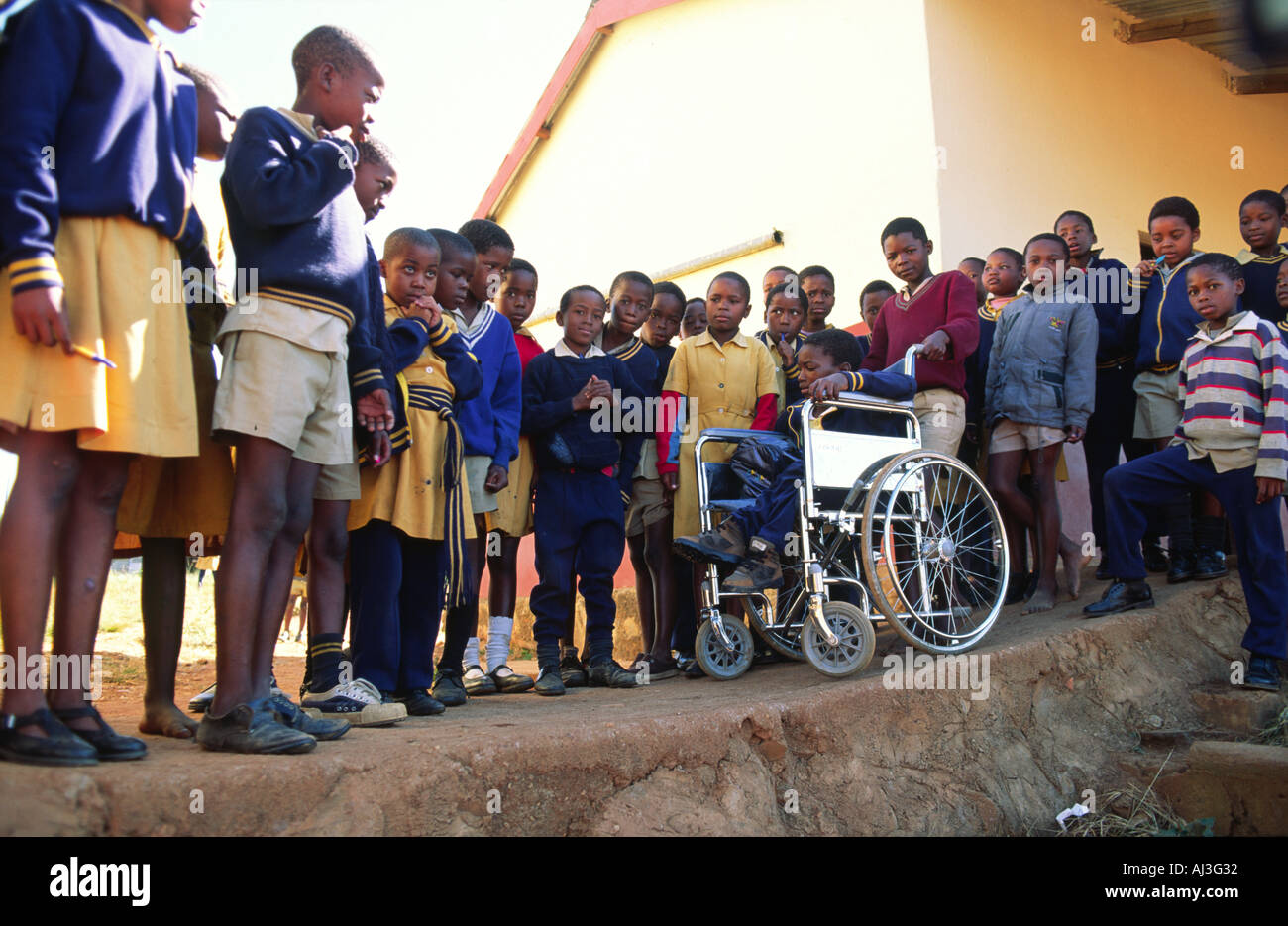 A child in a wheelchair using the ramp devised for children with Stock ...