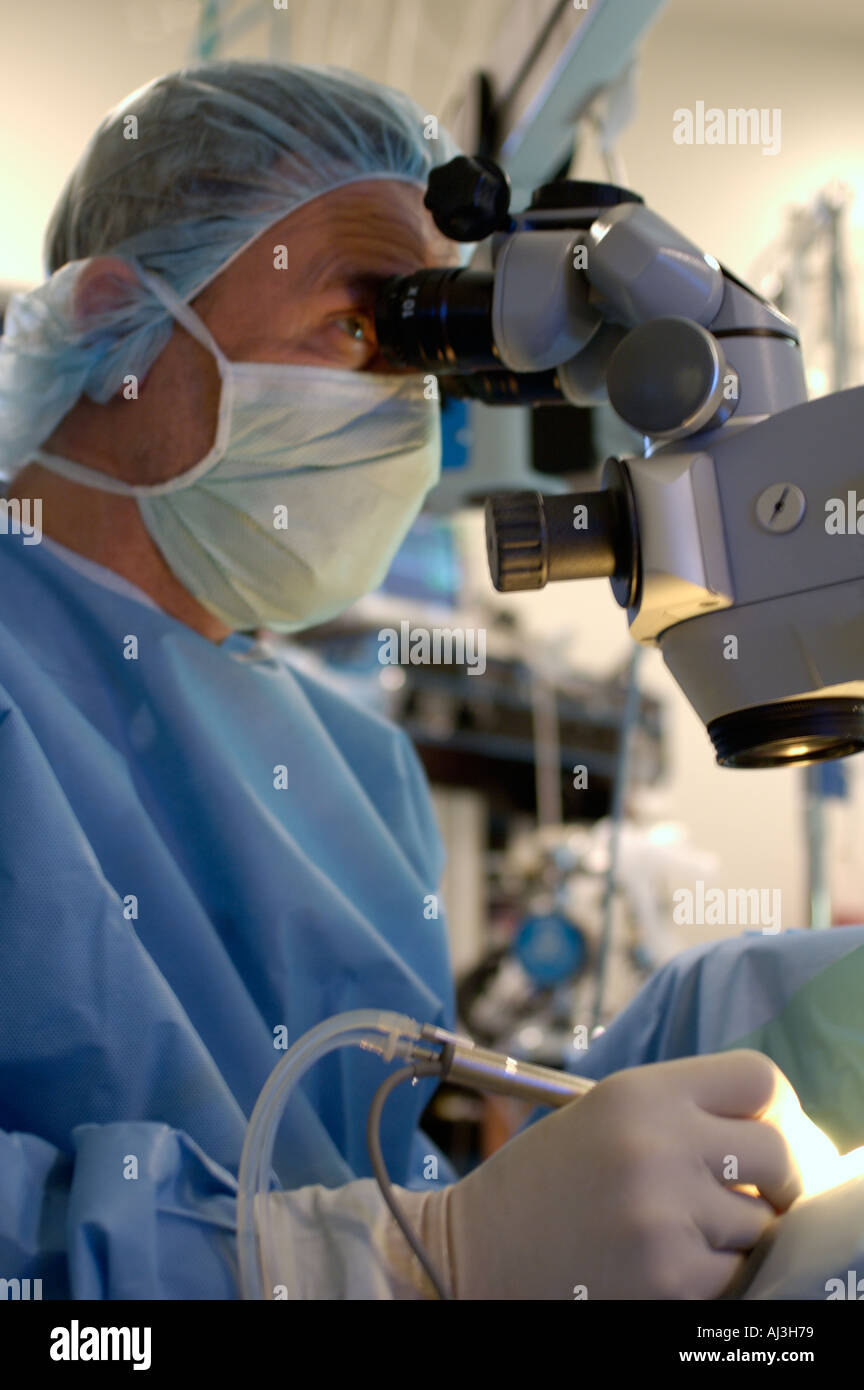 Cataract Surgery Surgeon operating through microscope on a patients eye ...