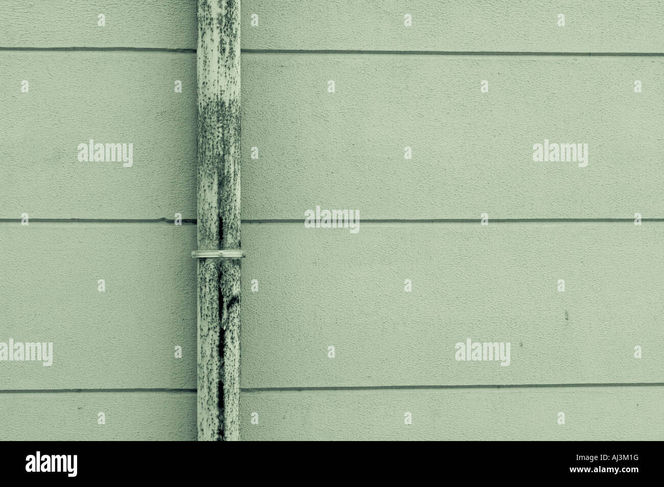 Detail of a drain pipe against a wall Stock Photo - Alamy
