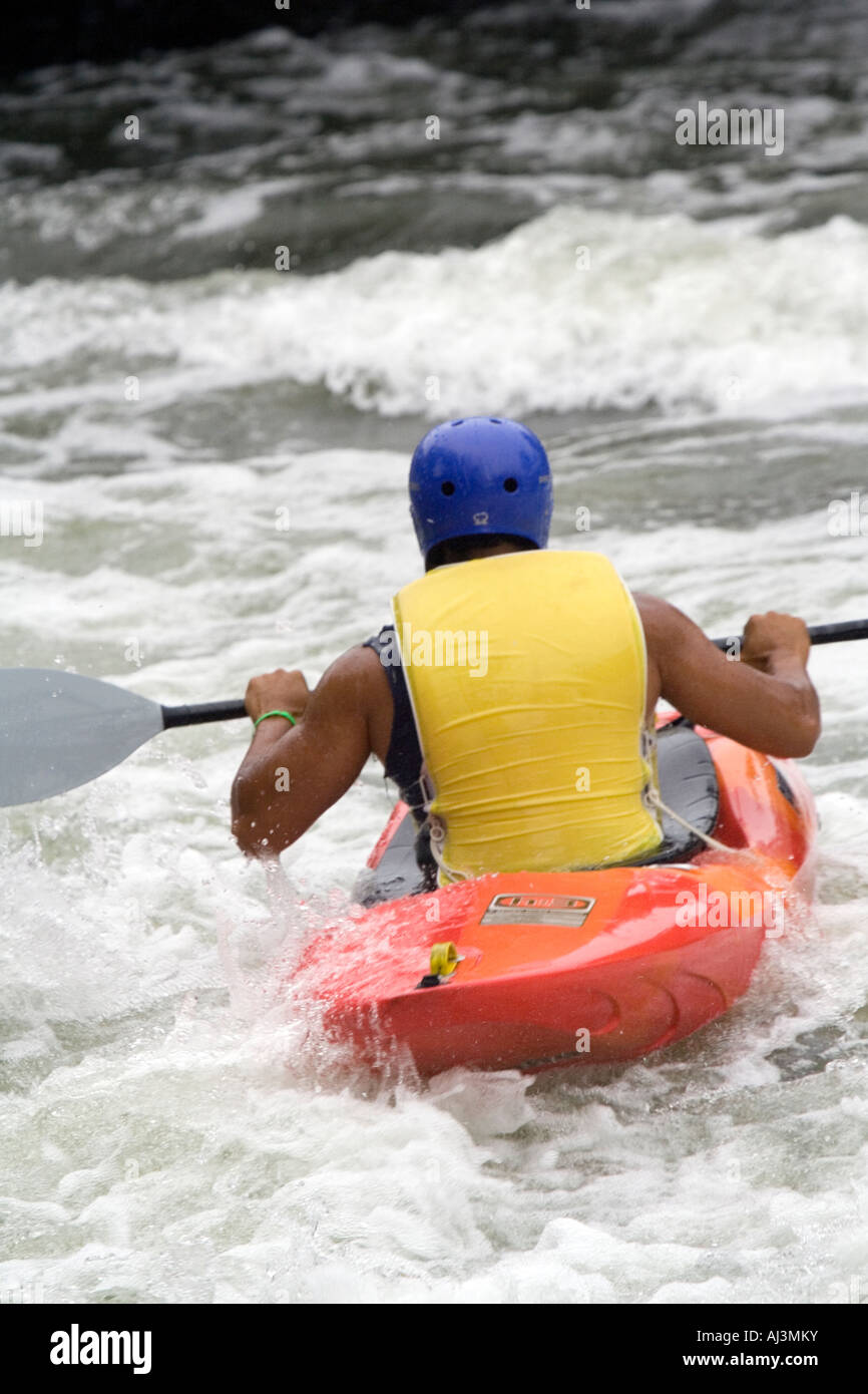 Rear view of man kayaking down whitewater river Stock Photo - Alamy