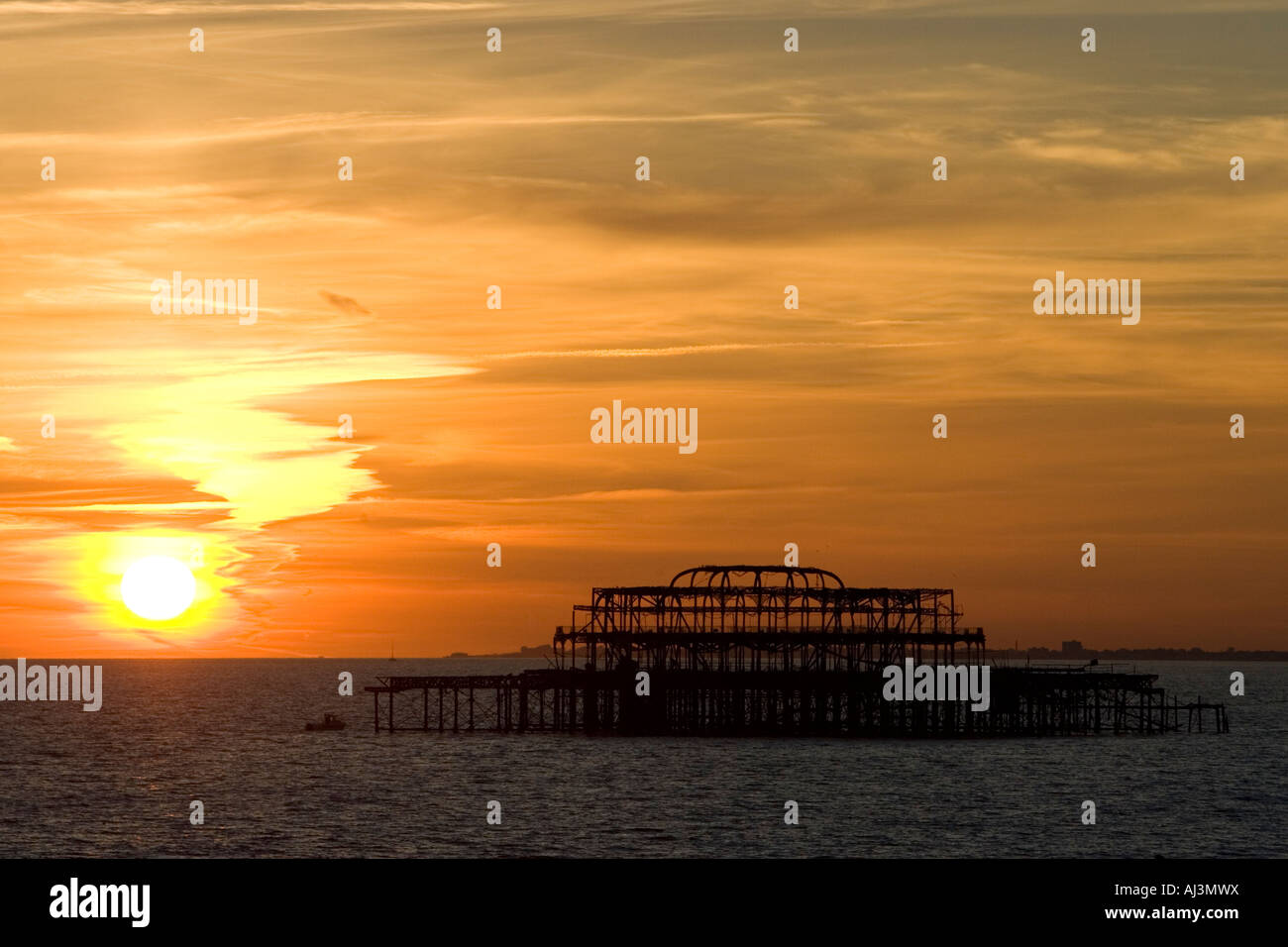The burnt out remains of Brighton's West Pier during sunset, Brighton ...