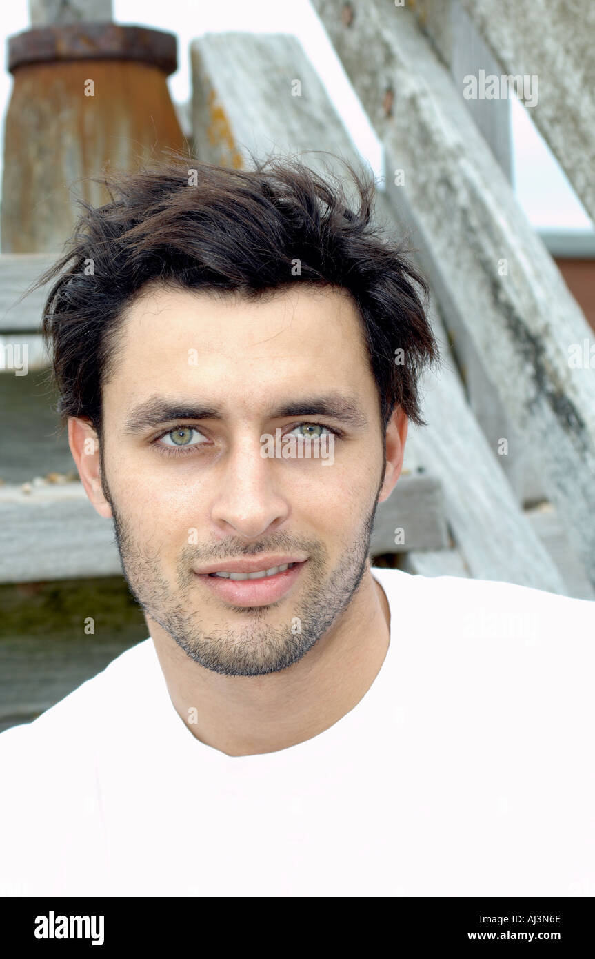 handsome man looking at the camera and smiling Stock Photo - Alamy