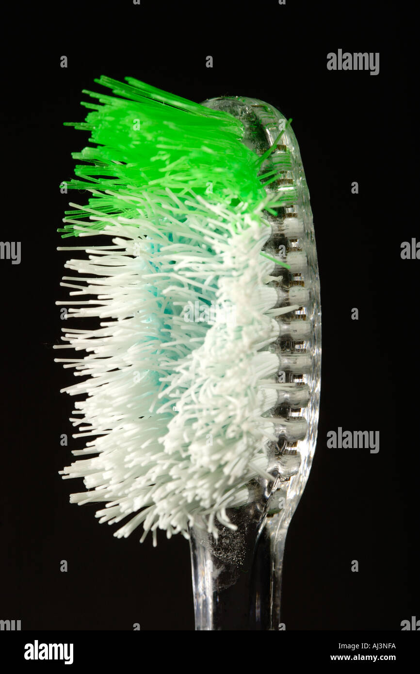 Worn toothbrush close up Stock Photo - Alamy