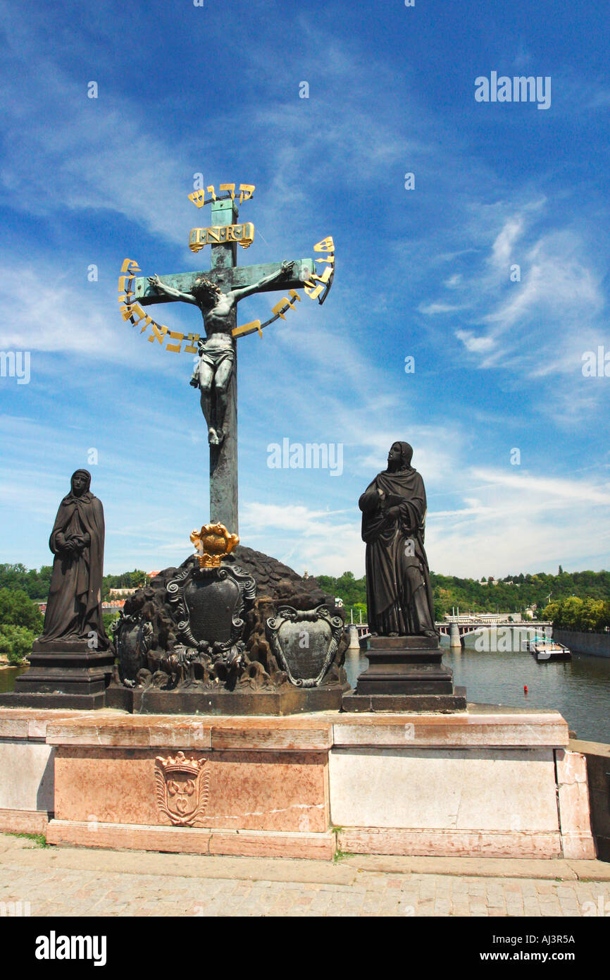Crucifixion cross and statues of St Vitus on Charles IV Bridge Prague ...