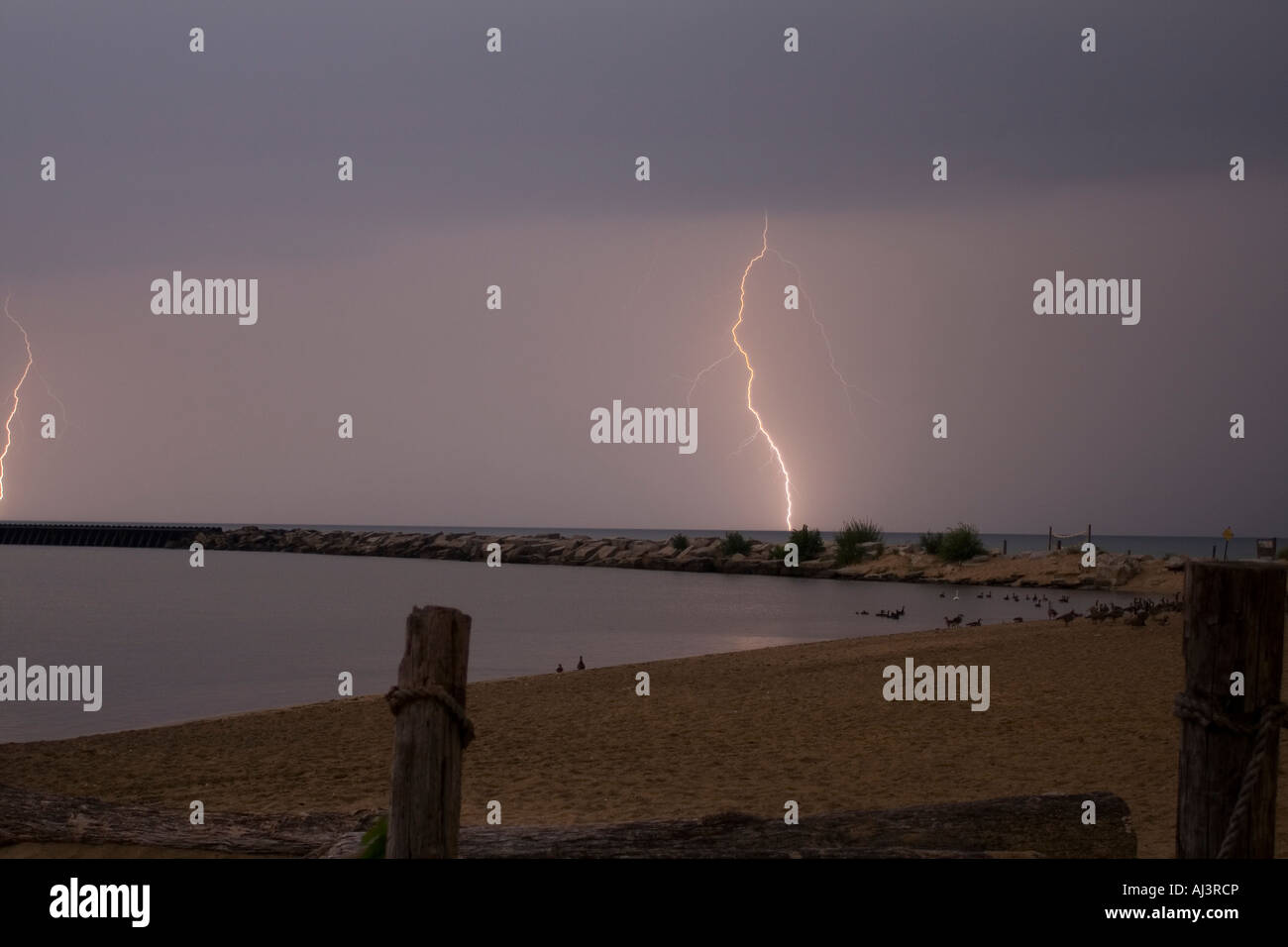 Lightning striking water at night near beach in New Buffalo, Michigan ...