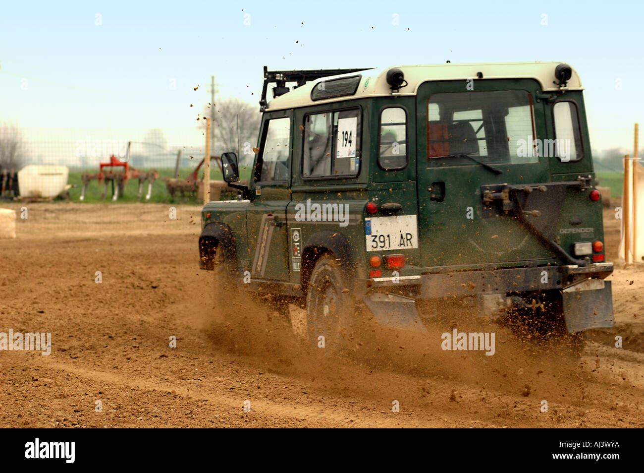 Land Rover Classic Defender long chassis turning fast in a muddy ...