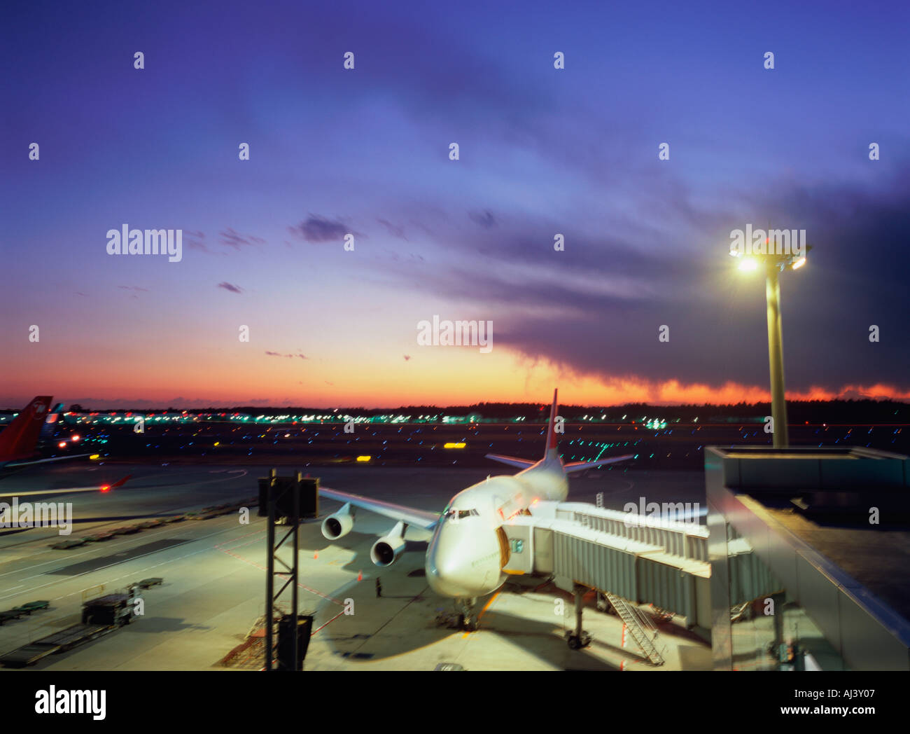 Airplane parked at airport gate Stock Photo - Alamy