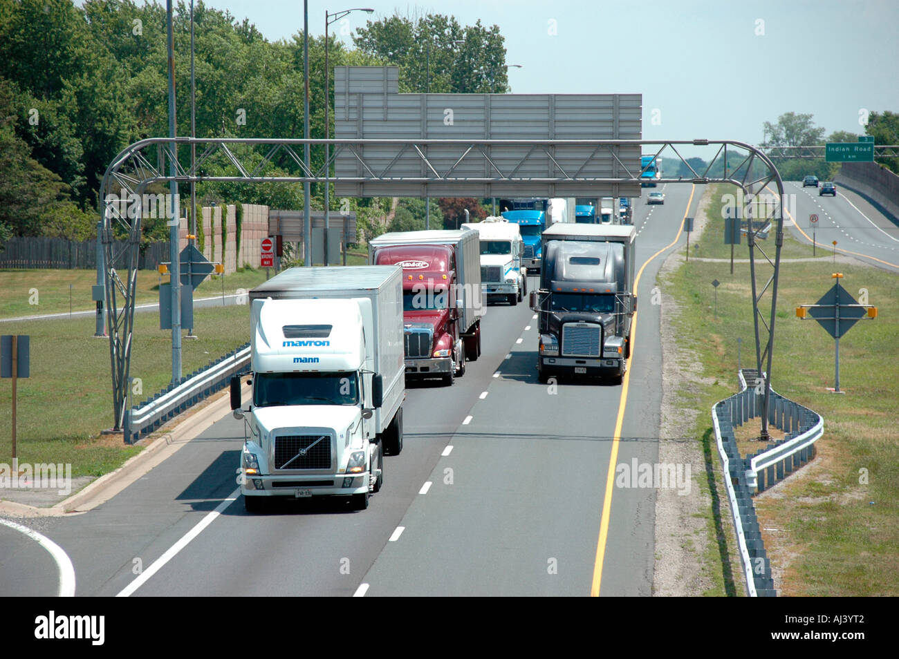 Commercial Trucks in highways roads freeways with cars moving to the ...