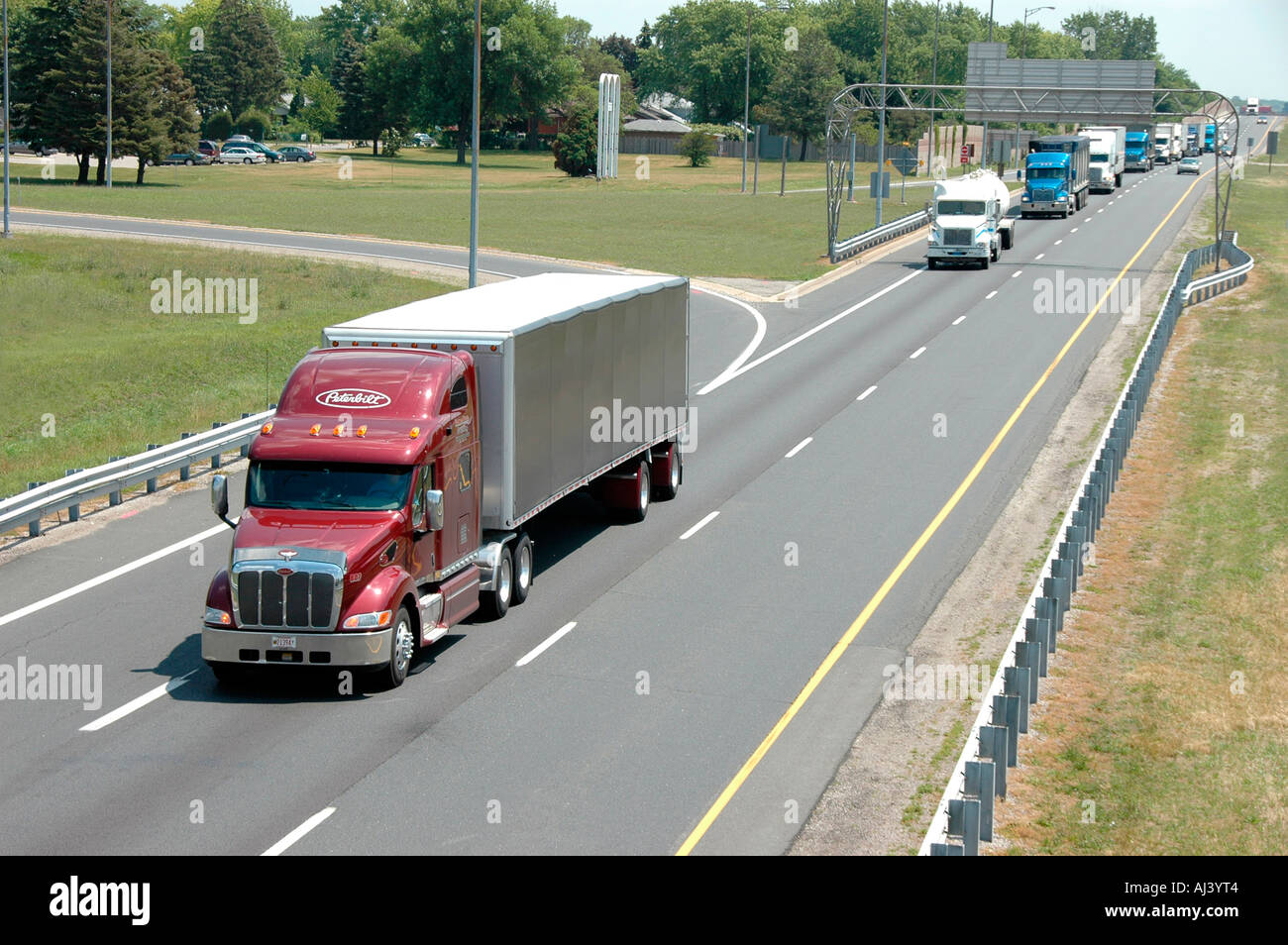 Commercial Trucks in highways roads freeways with cars moving to the ...