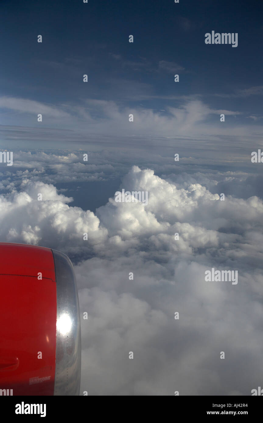 Clouds through a passenger window of a jet plane Stock Photo - Alamy